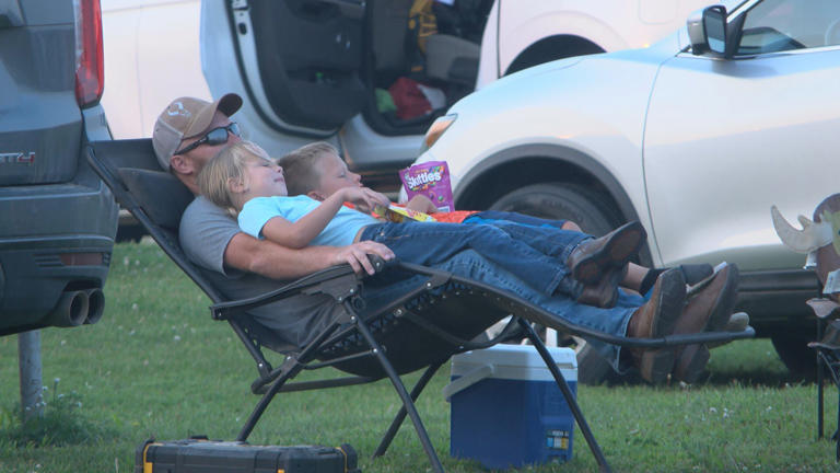 Families kick back for drive-in cinema surrounded by fields in Neligh
