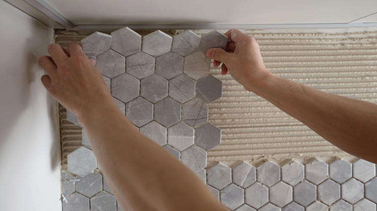 14 Backsplashes That Complement Stainless Steel Kitchens