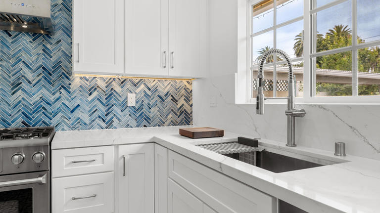 14 Backsplashes That Complement Stainless Steel Kitchens