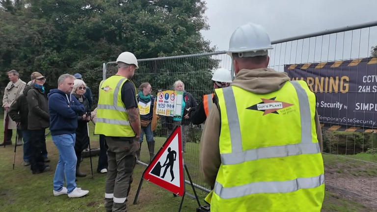 Chained protester stops footbridge demolition