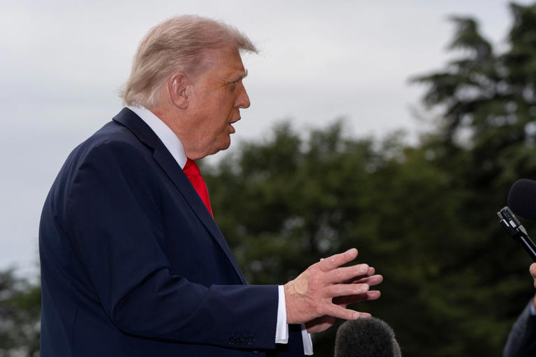 White House puts out new picture showing Donald Trump’s makeup-covered hand