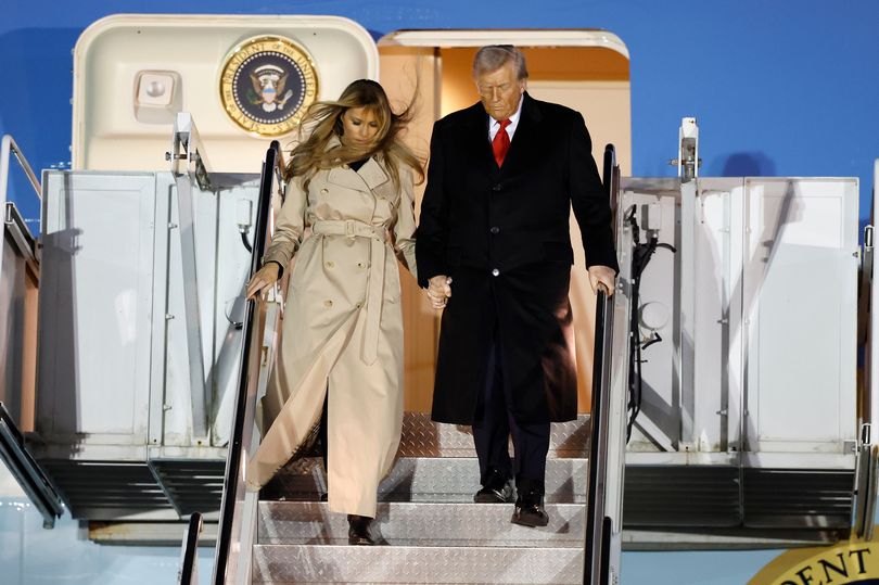 Donald Trump 'steadied by Melania' after 'wavering' on stairs ...