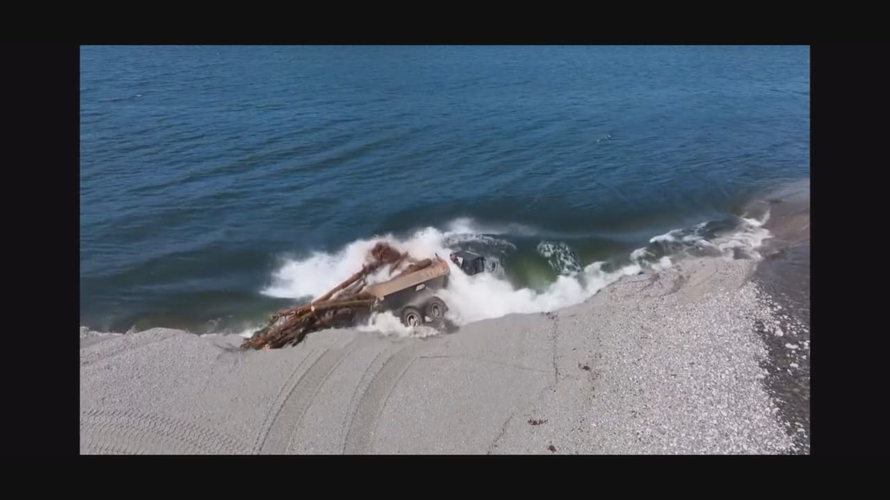 Dramatic shoreline collapse sends huge truck into B.C. lake