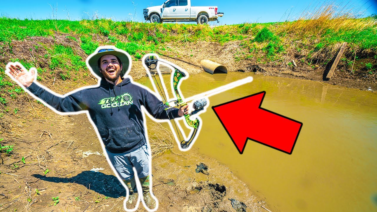 Bow fishing nasty sewer for big fish! (Catch clean cook) - 2 fish 1 shot