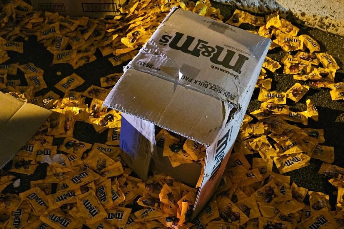 Melts on the highway: Thousands of M&Ms spill across the road after ...