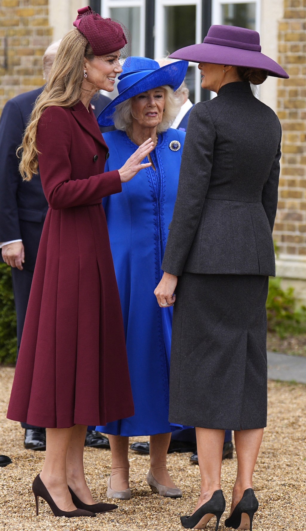 Queen Camilla appears to shoo Kate Middleton away from Melania Trump in ...