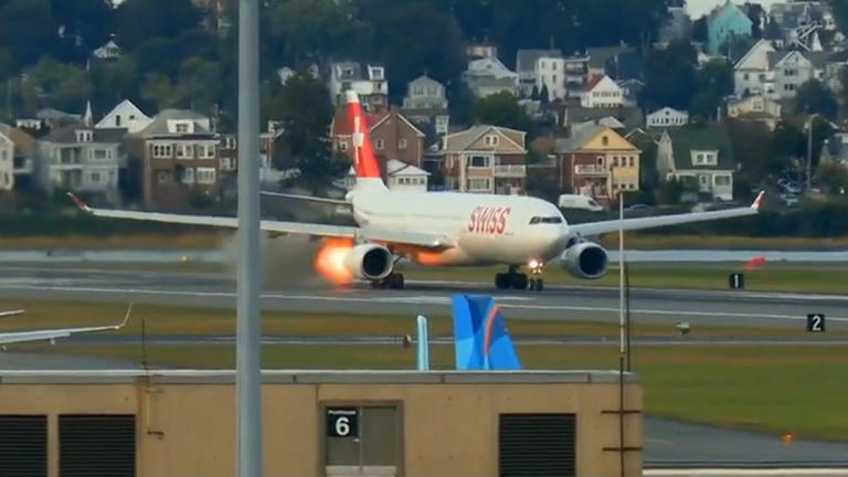 Flames shoot out of Swiss plane engine during takeoff