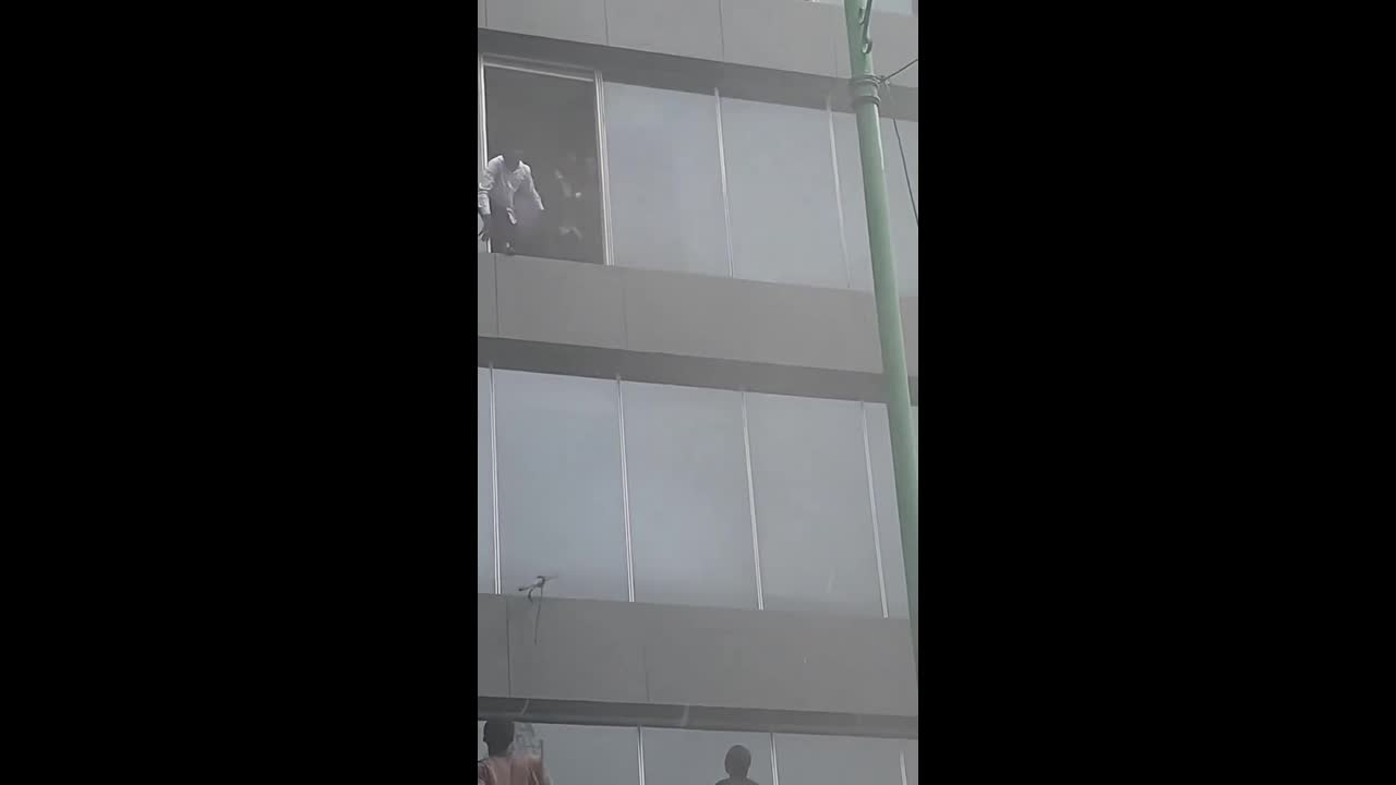 Bank staff jump from burning building in Nigeria