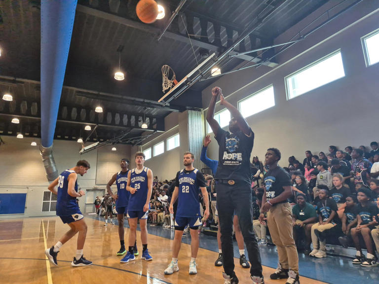 UNO basketball team makes surprise visit to Oaklawn Middle School students