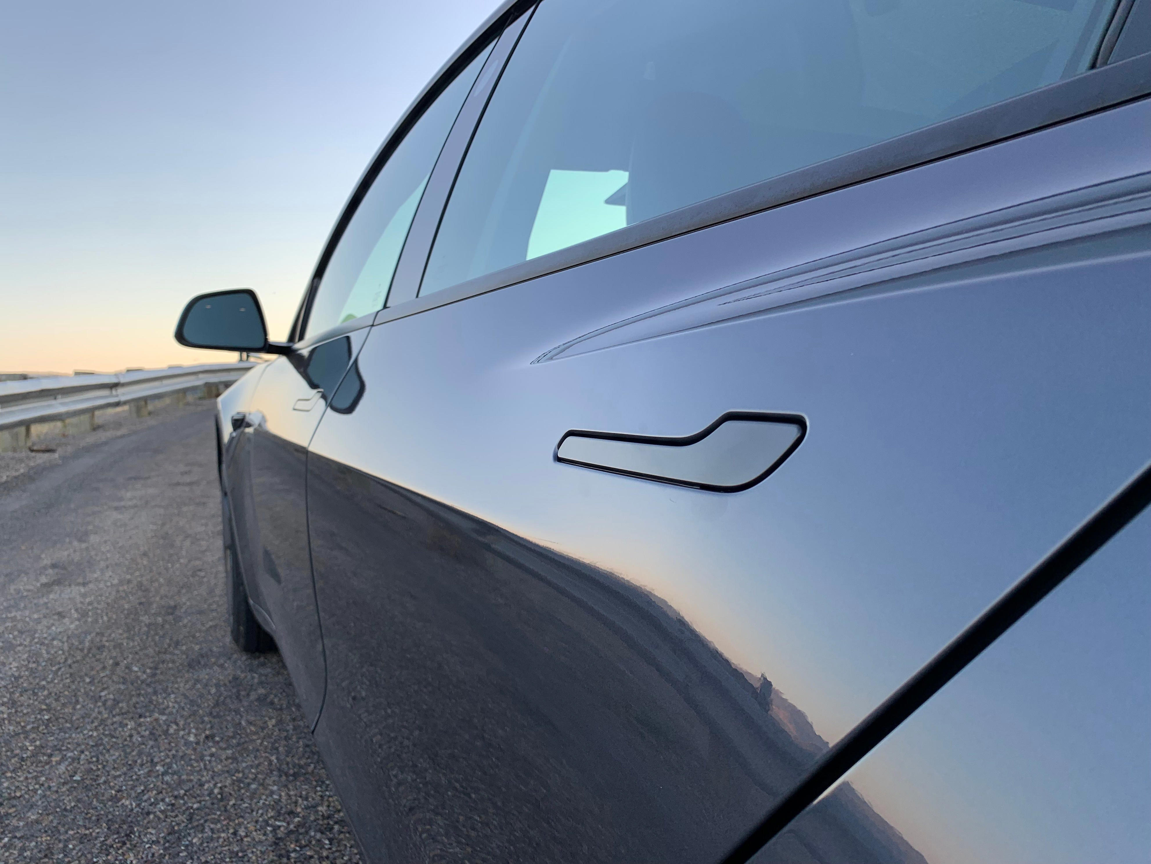 Tesla is redesigning its door handles after some parents reported ...