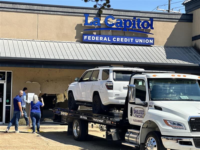Police officer hurt, car crashes into credit union in Pineville