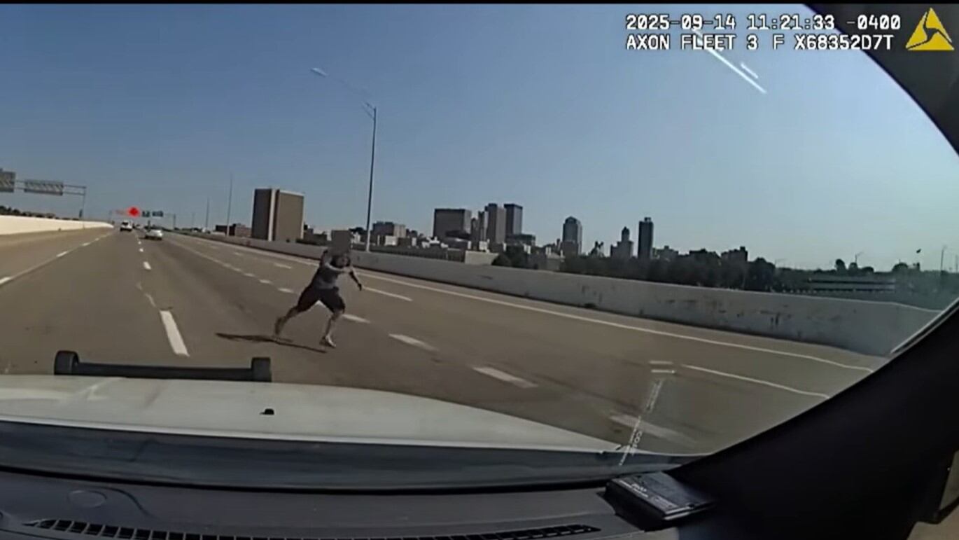 DASH CAM: Suspect tries to escape police by running across I-75