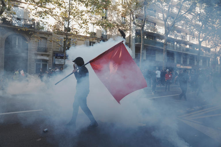 Strikes and protests roil France, pitting the streets against Macron ...