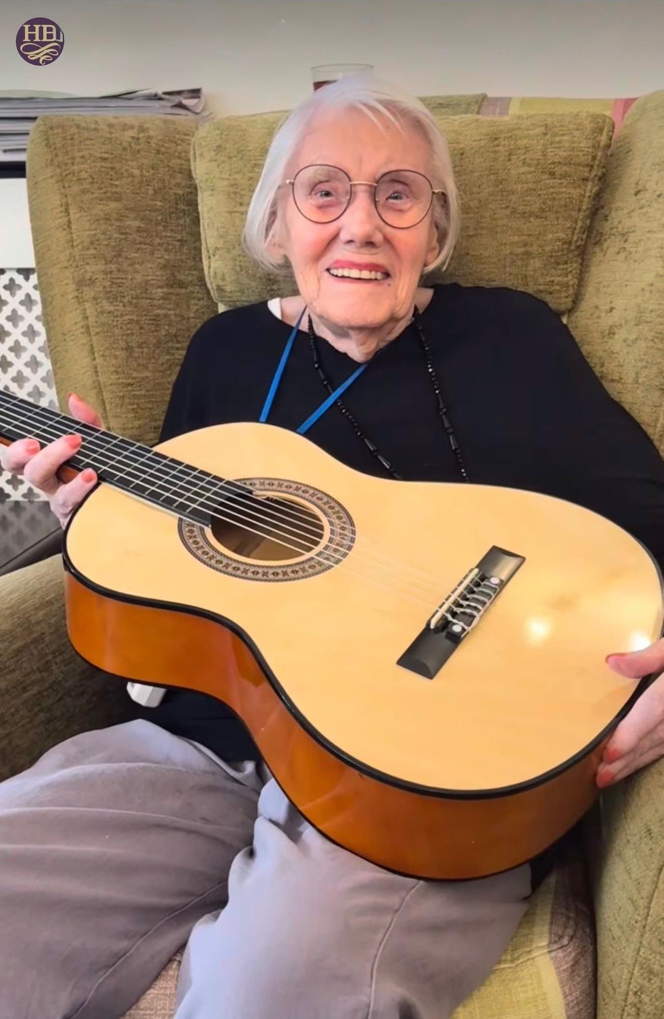 Crowborough care home resident overjoyed as lifelong guitar wish granted