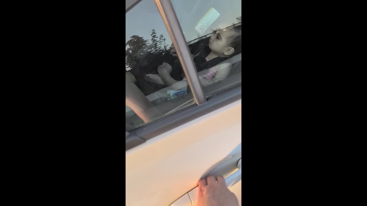 Baby startled then smiles in car seat in Mississauga, Canada