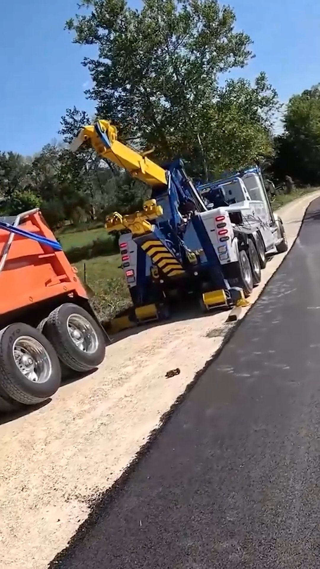 Dump Truck with Hot Asphalt Slides Off Gravel Shoulder