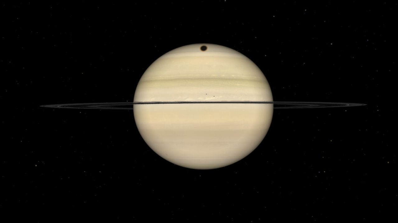 Titan's shadow crosses Saturn as the planet offers up its best views of ...