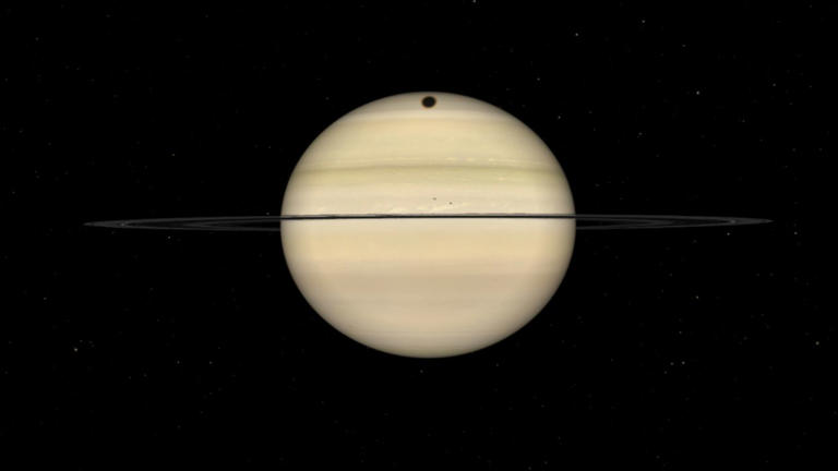 Titan's shadow crosses Saturn as the planet offers up its best views of ...