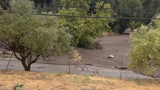 Shocking Moment Torrent of Muddy Water Barrels Through Oak Glen, California