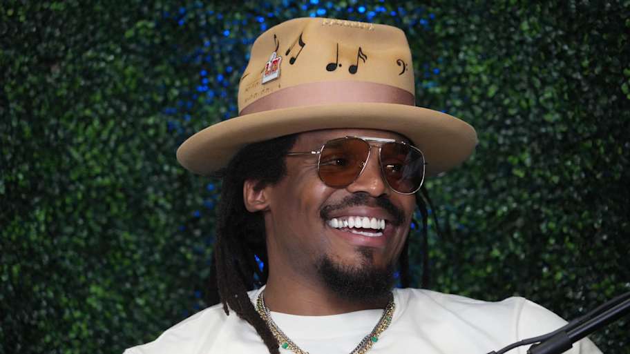 Cam Newton makes Triple H look tiny flexing Shawn Michaels' signature pose