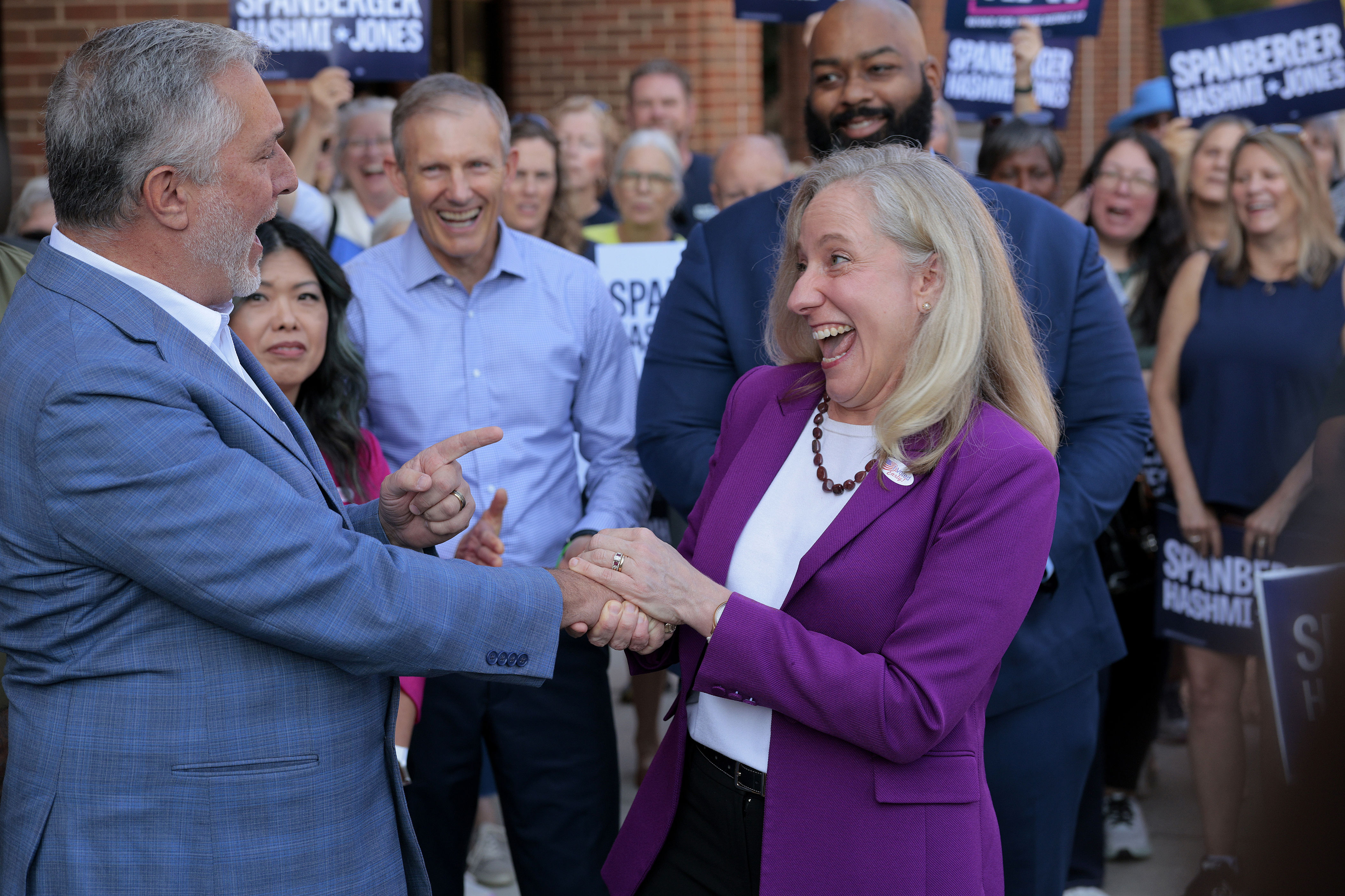 As voting starts in Virginia, a tense scene turns chummy between candidates