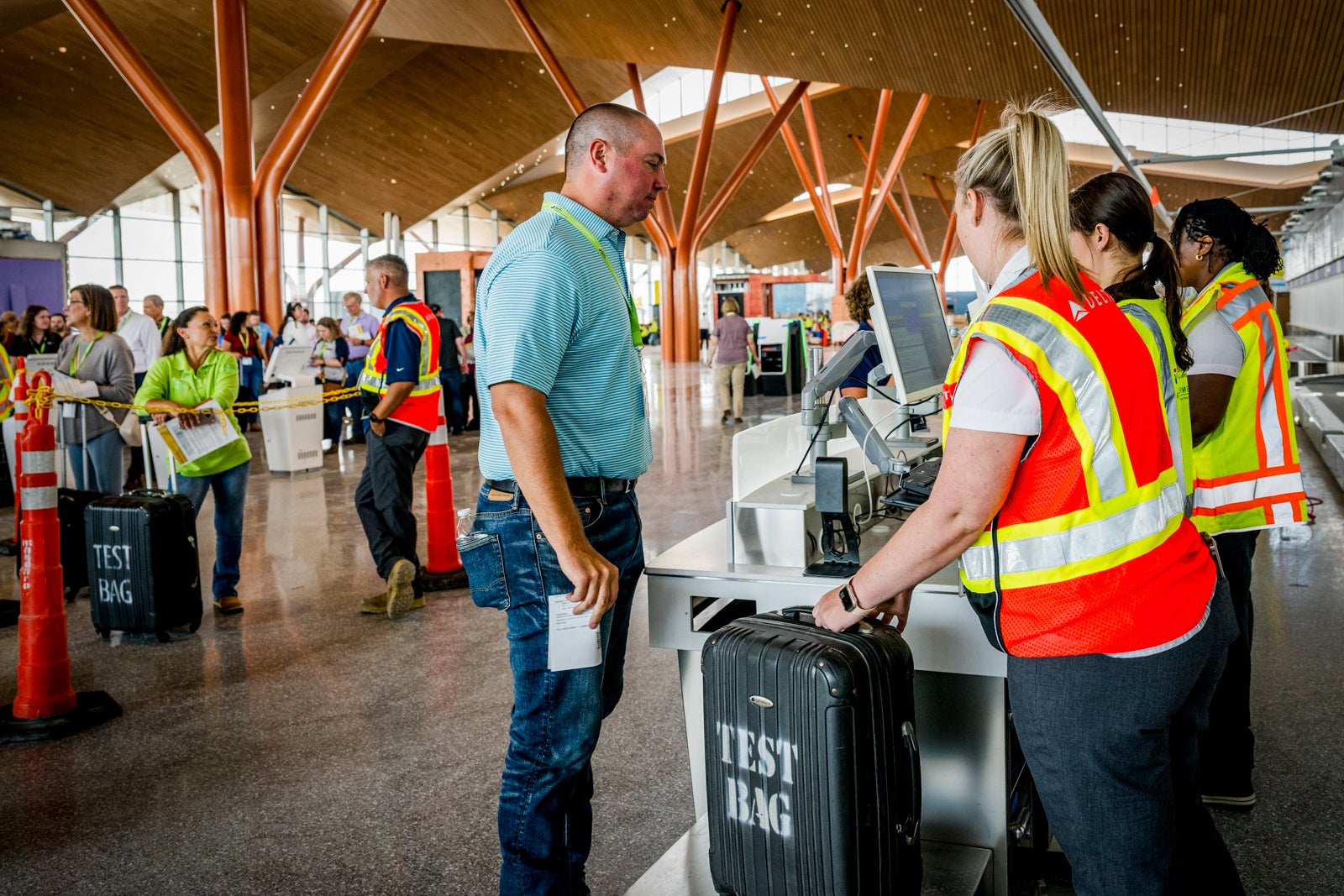 Why do airports invite fake passengers to test new terminals?