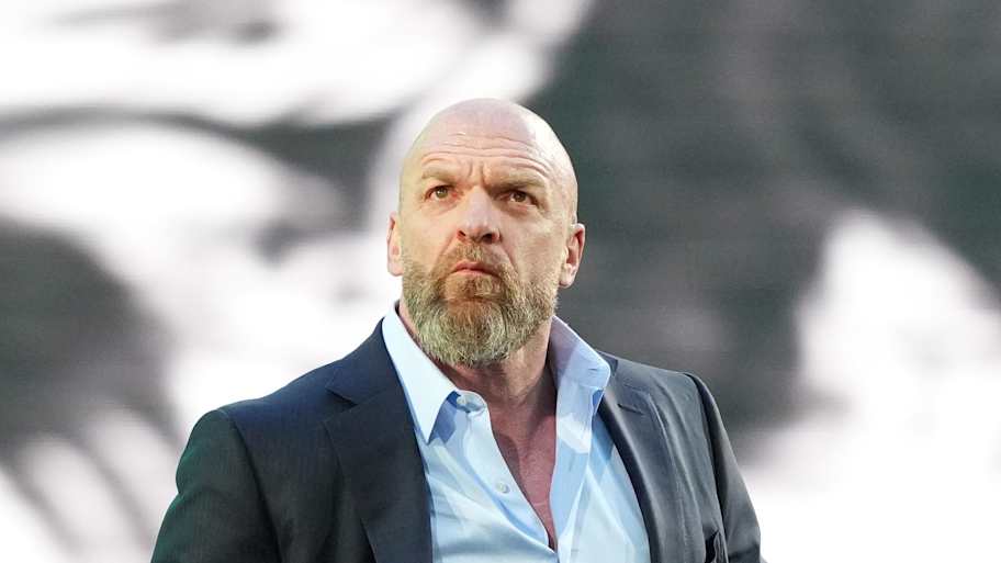 Cam Newton makes Triple H look tiny flexing Shawn Michaels' signature pose