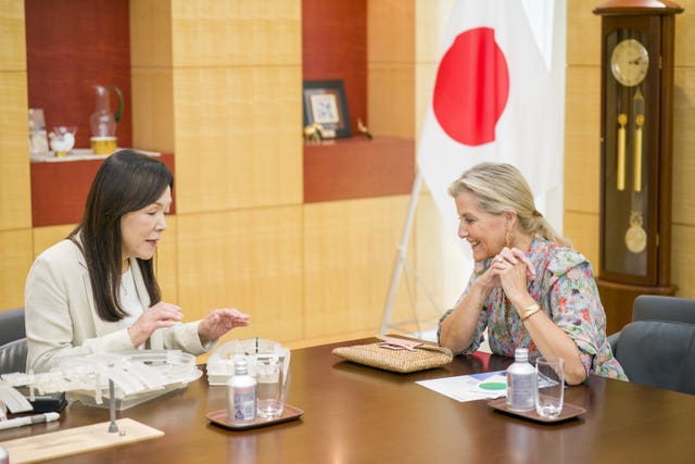Duchess of Edinburgh interacts with robot dog during Japan visit