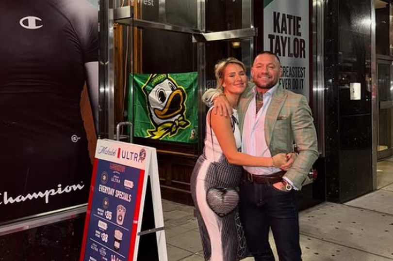 Conor McGregor and Dee Devlin pose beside Katie Taylor picture as they ...