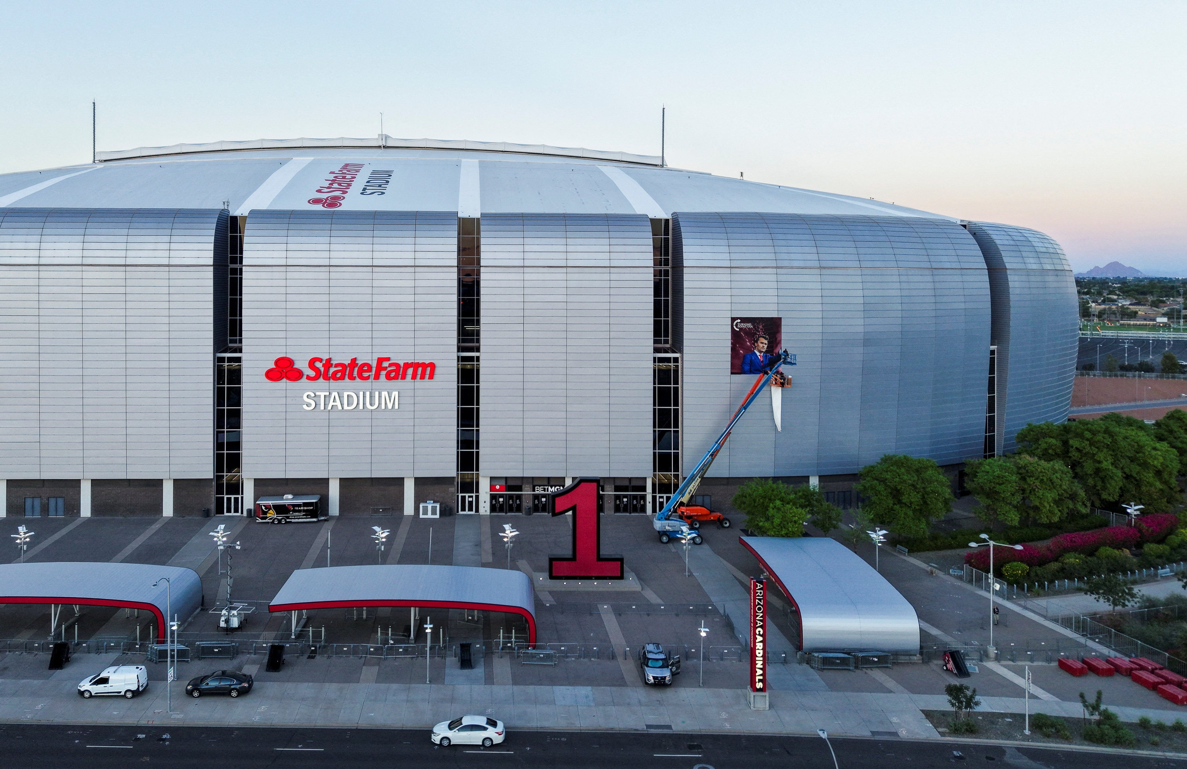 Armed man detained at stadium where Charlie Kirk's memorial service ...