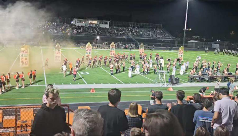 Fans angry at football team entering field during band performance ...