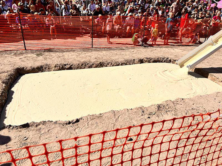 Contestants try to avoid falling into pit filled with 1,000 gallons of ...