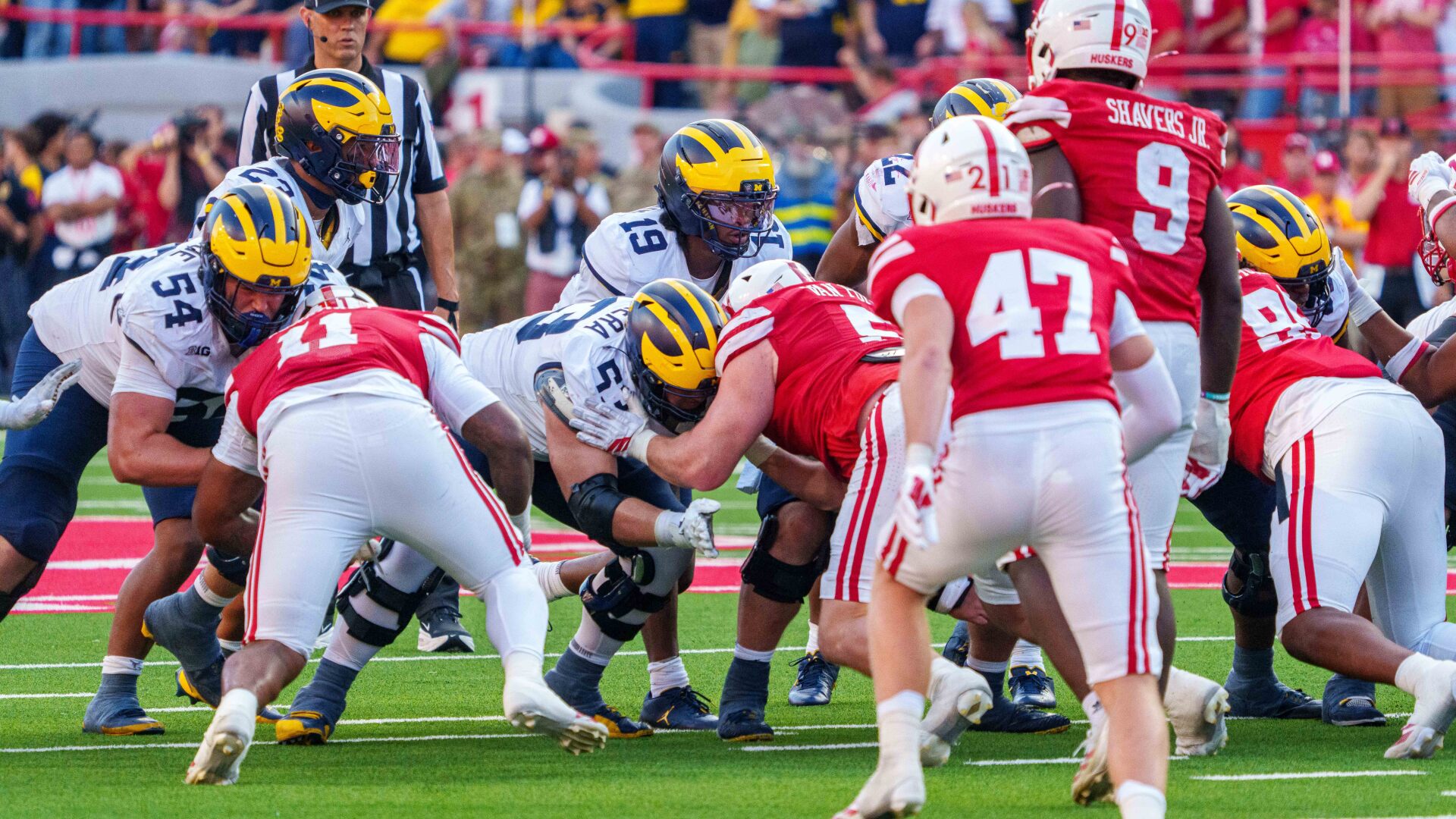 No. 21 Michigan uses three long touchdown runs to beat Nebraska 30-27