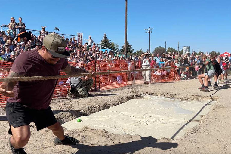 Contestants try to avoid falling into pit filled with 1,000 gallons of ...
