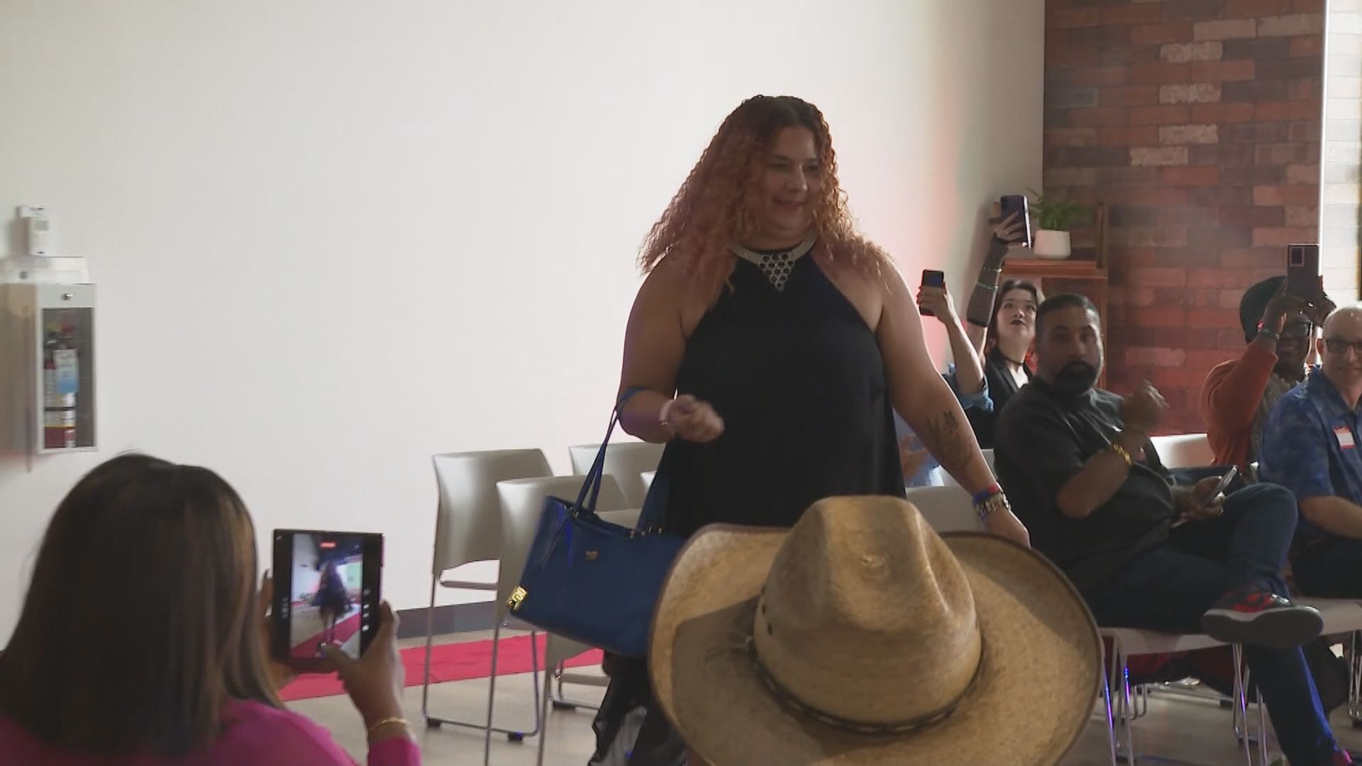 People recovering from addiction walk the red carpet during a local ...