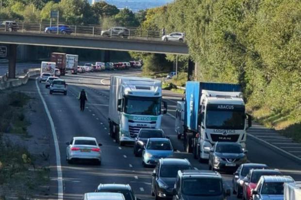 M3 closed after man seen on 'wrong side of railings' on bridge