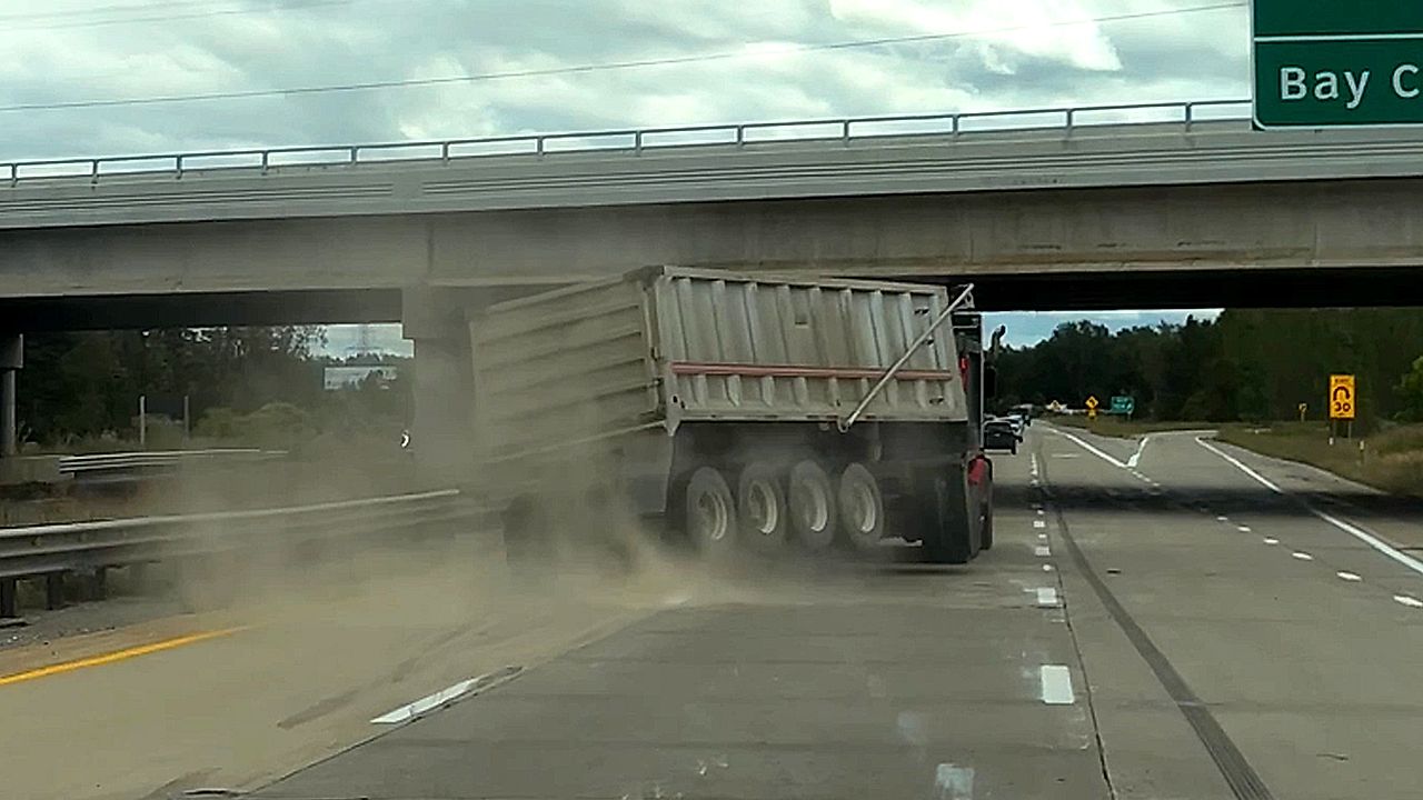 Truck trailer wildly swings like high-speed wrecking ball all over ...