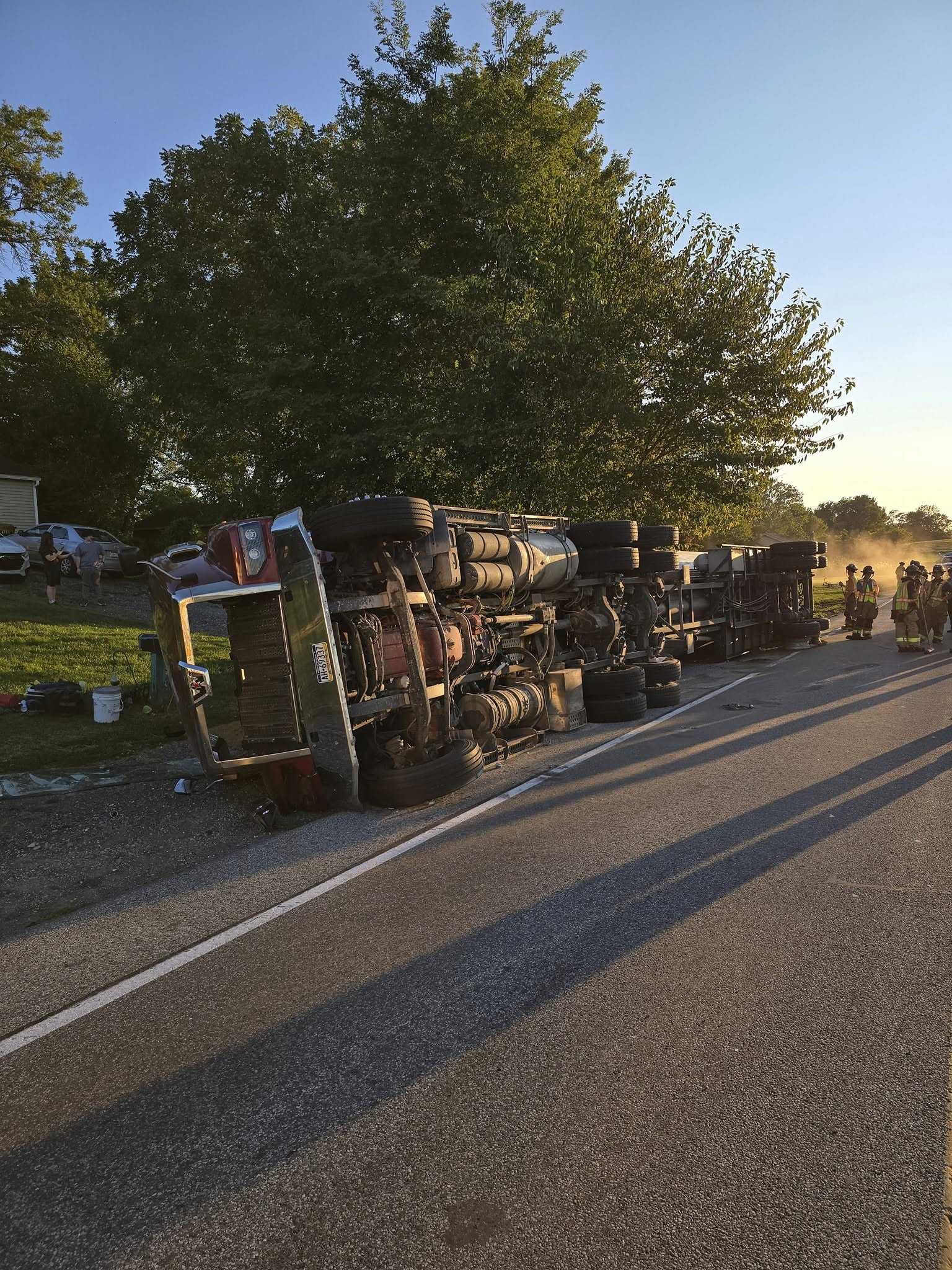 Neighbor breaks windshield to rescue driver after tanker truck ...