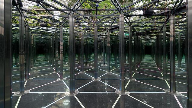 Confident man attempts speed round in mirror maze