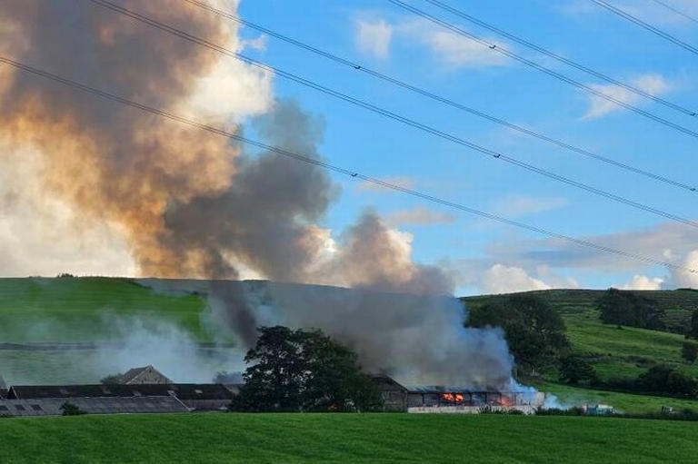 Eight fire engines battle huge blaze using water pumped from river ...