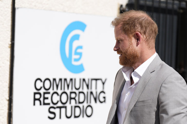 Duke of Sussex met with cheers from crowd of fans ahead of charity donation