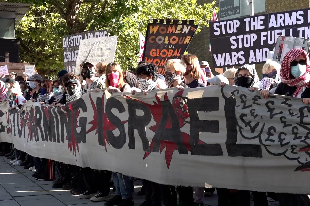Three arrested after protest outside defence event