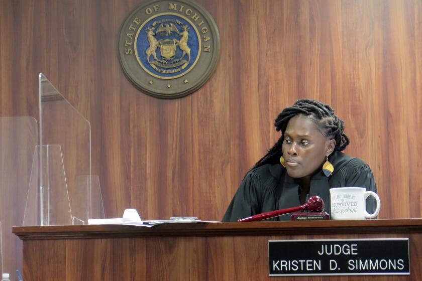 Michigan judge tosses case against 15 accused fake electors for ...