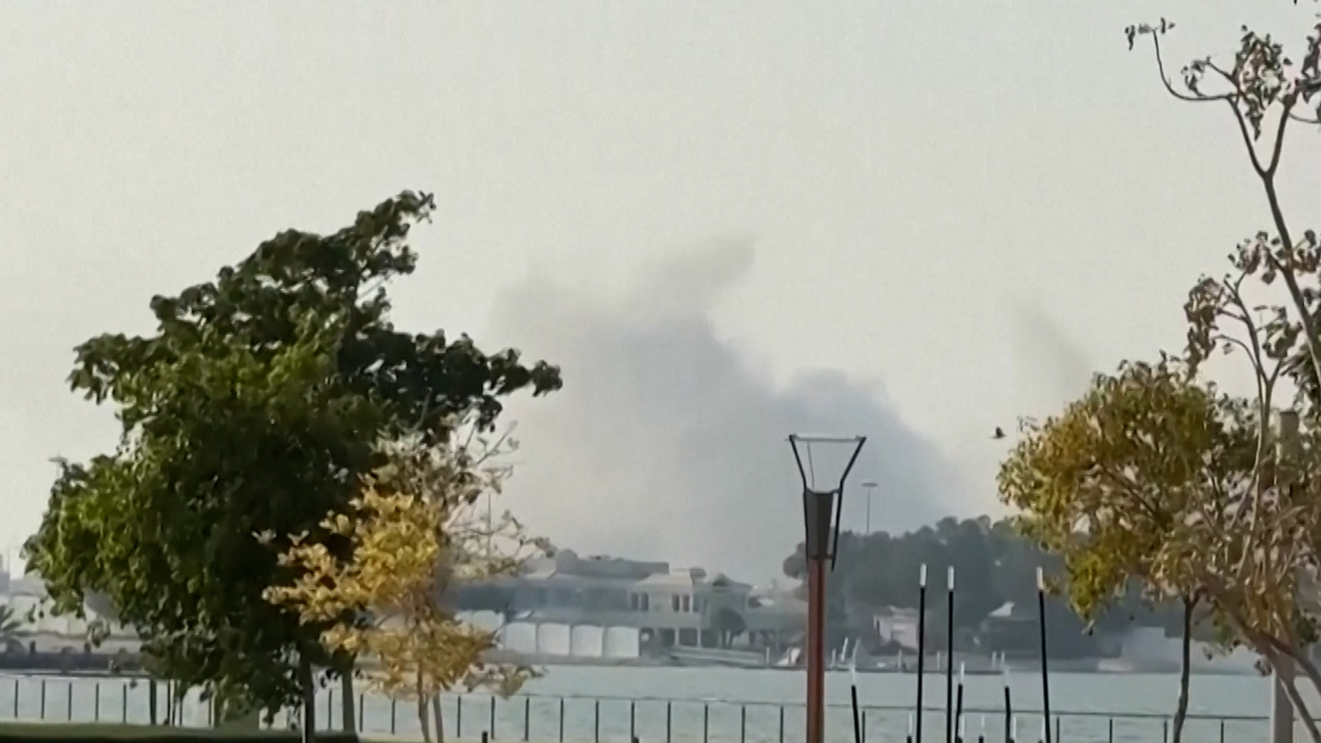 Smoke rises over Doha after explosions