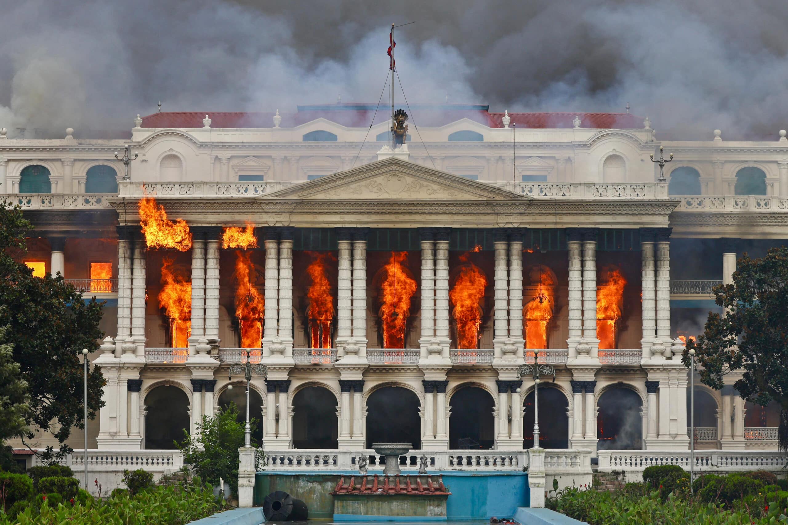Nepal protesters set parliament ablaze as PM quits