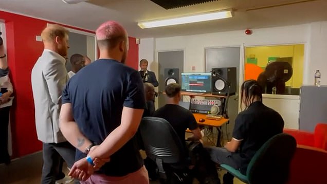 Prince Harry bops his head to rap beat as he visits community studio in ...