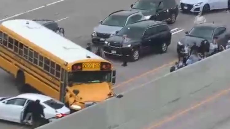 Crash involving school bus carrying students shuts down traffic on I-35W