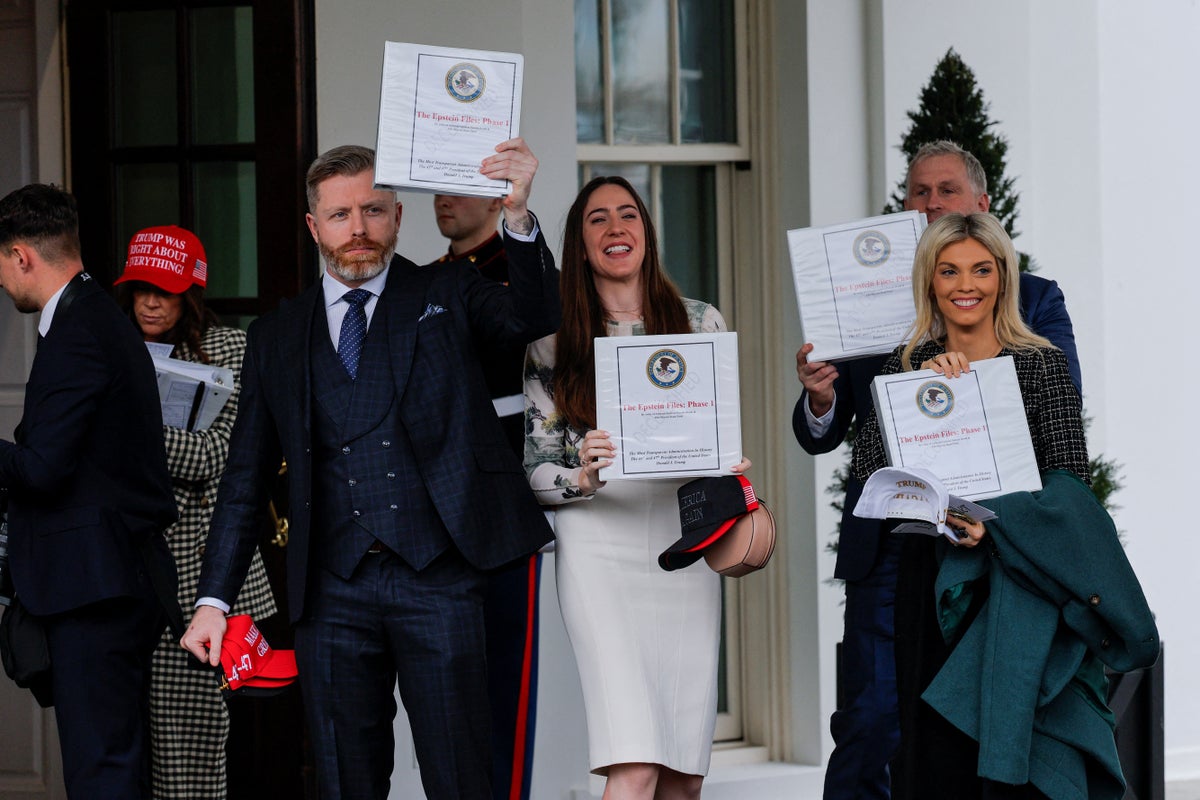 Influencer who was photographed celebrating with a binder of Epstein ...