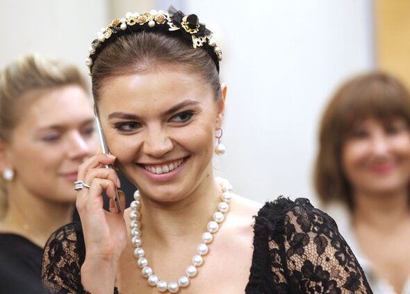 Vladimir Putin debuts 'new Tsarina' former Olympic gymnast with 30 year ...