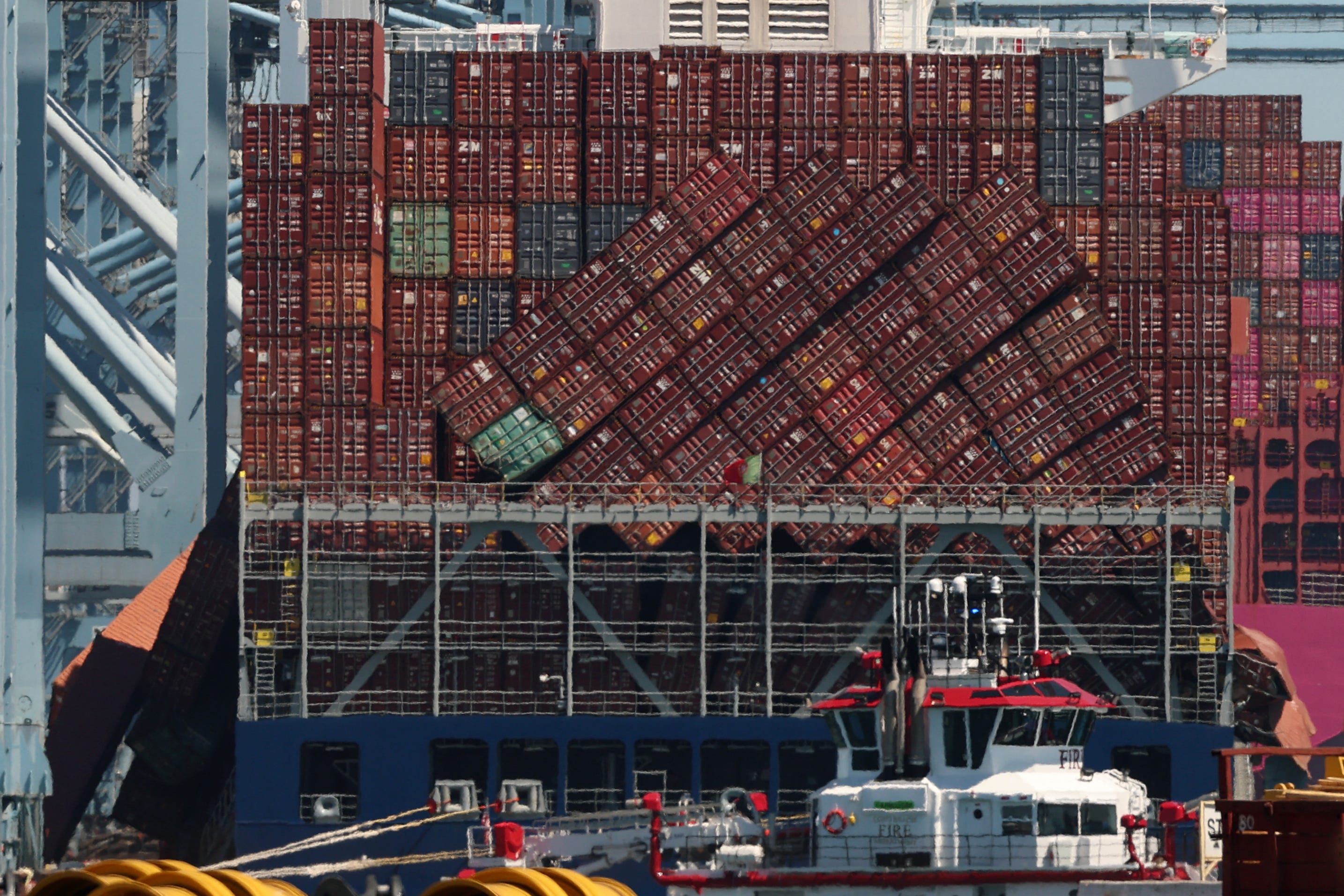 Watch dozens of containers slide off a ship into a California port